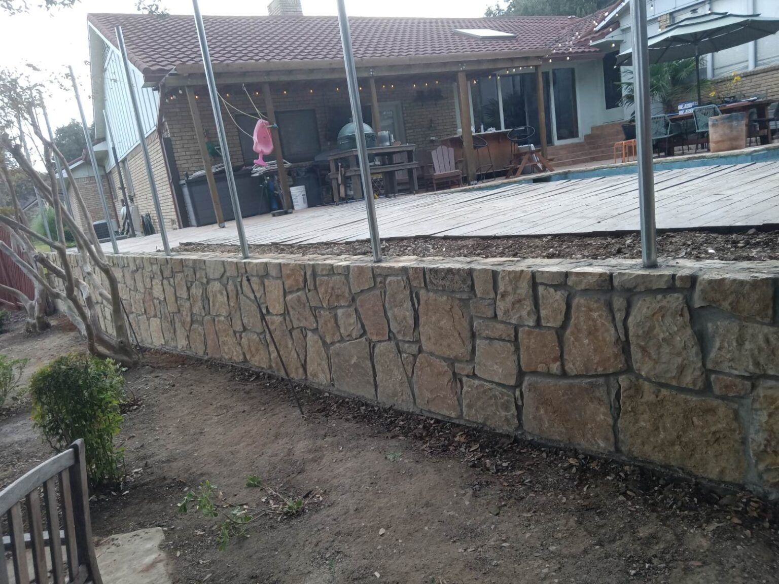 Replacing a concrete wall with a milsap stone wall in Irving